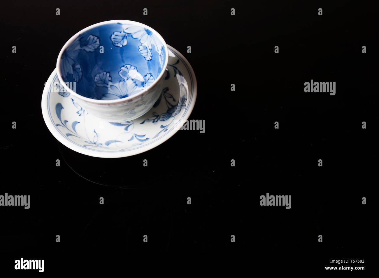 Traditional Japanese pottery isolated on black background Stock Photo ...