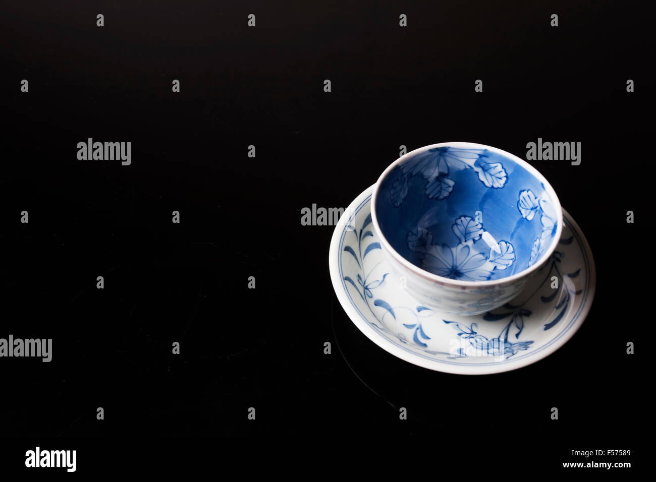 Traditional Japanese pottery isolated on black background Stock Photo ...