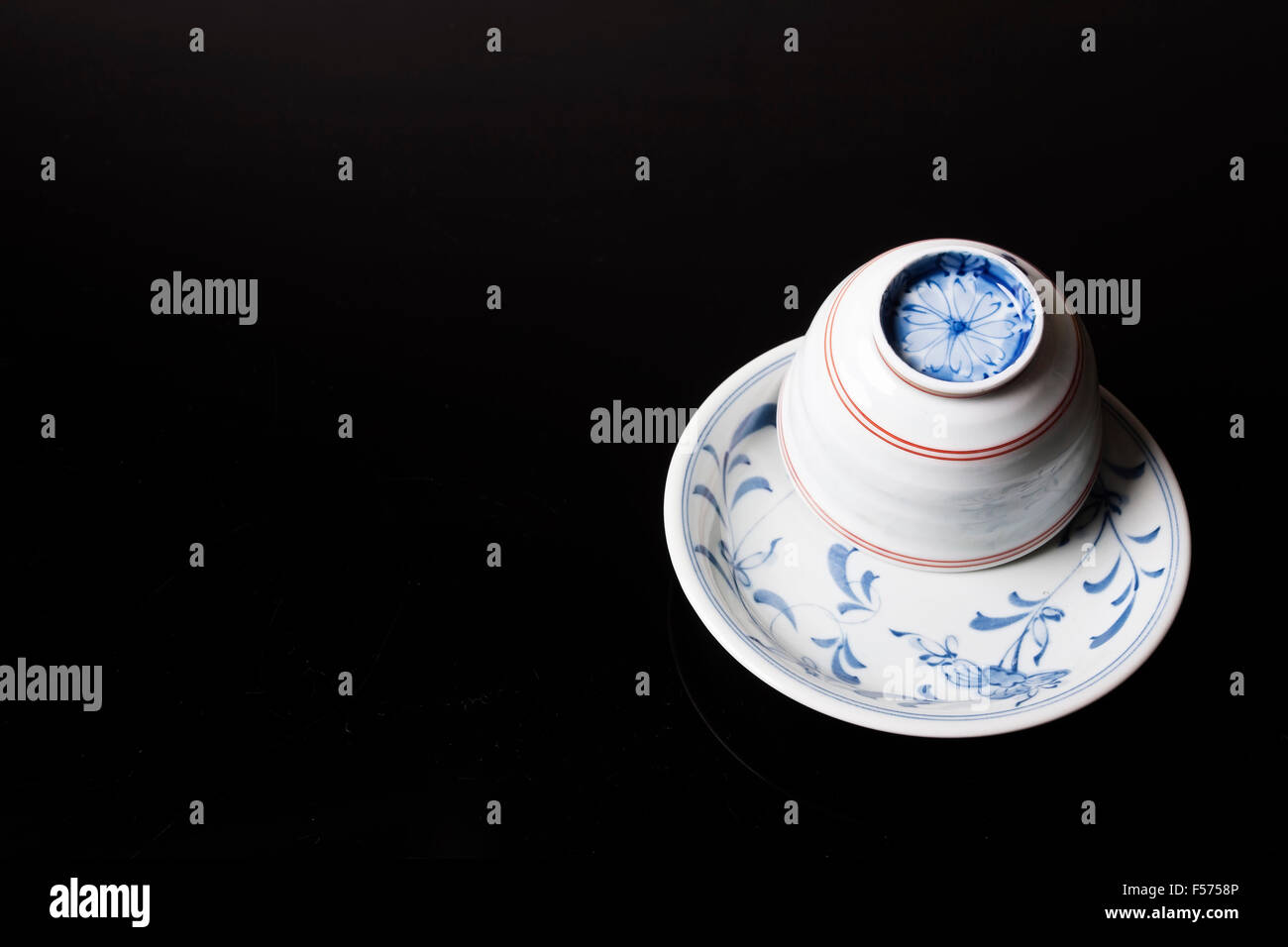 Traditional Japanese pottery isolated on black background Stock Photo ...