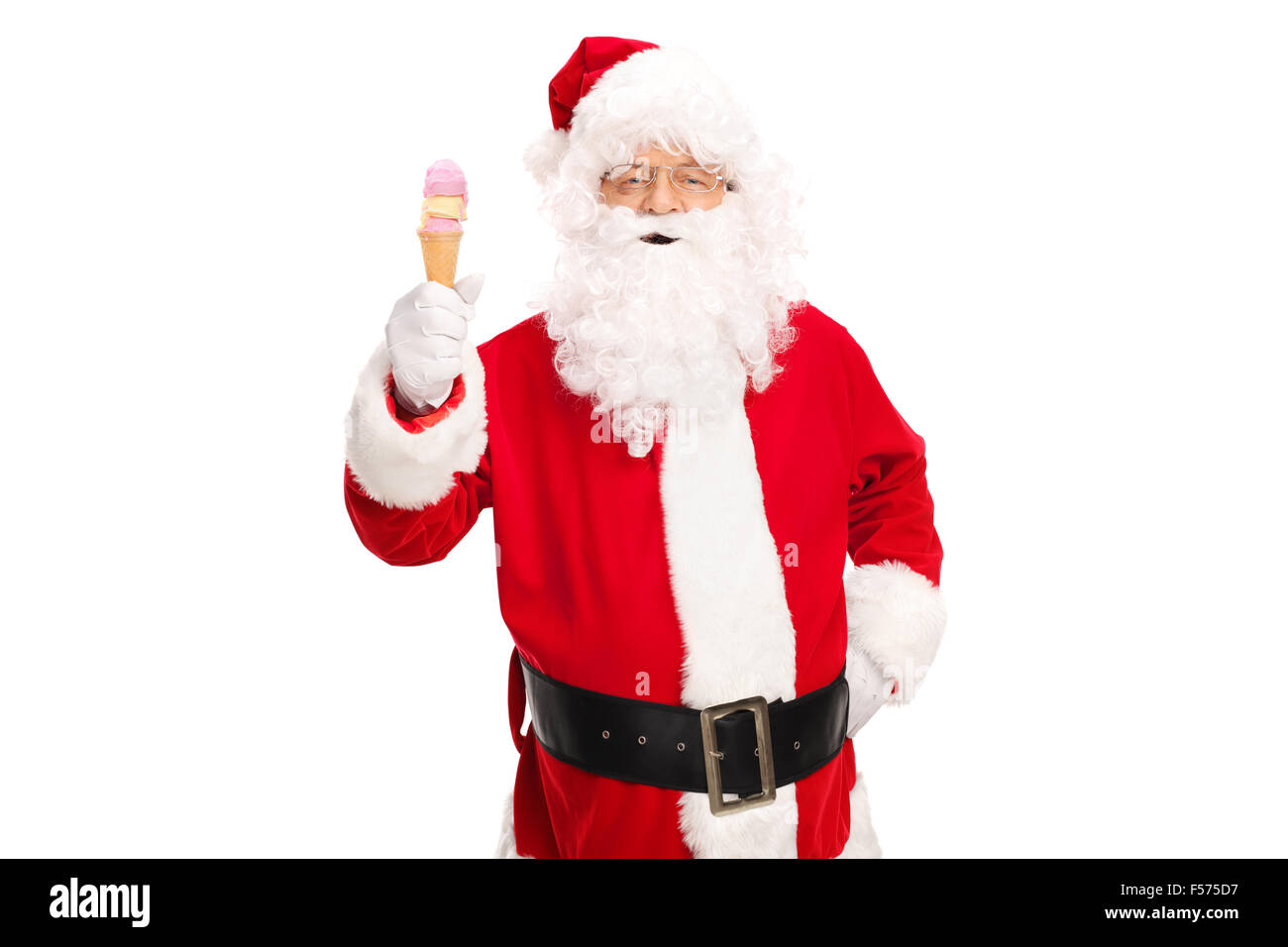 Studio shot of Santa Claus holding an ice cream cone and looking at the ...