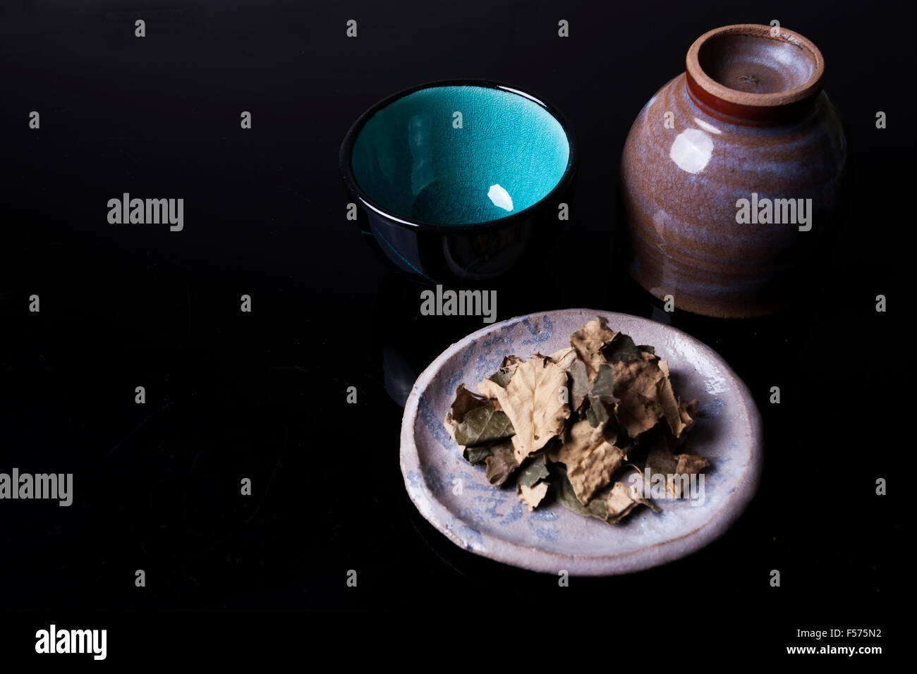 Traditional Japanese pottery isolated on black background Stock Photo ...