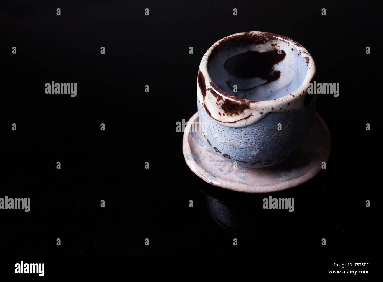 Traditional Japanese pottery isolated on black background Stock Photo ...