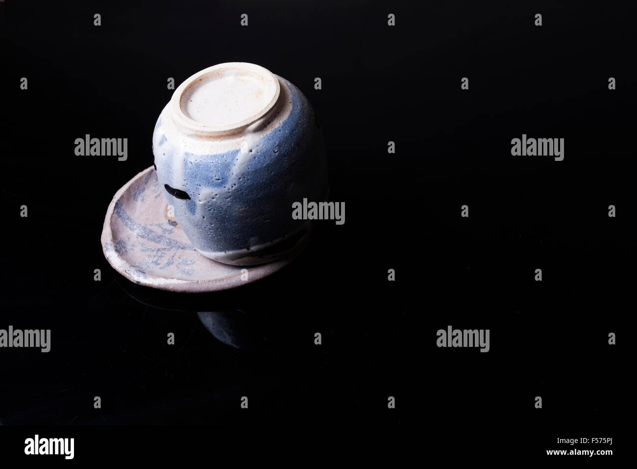 Traditional Japanese pottery isolated on black background Stock Photo ...