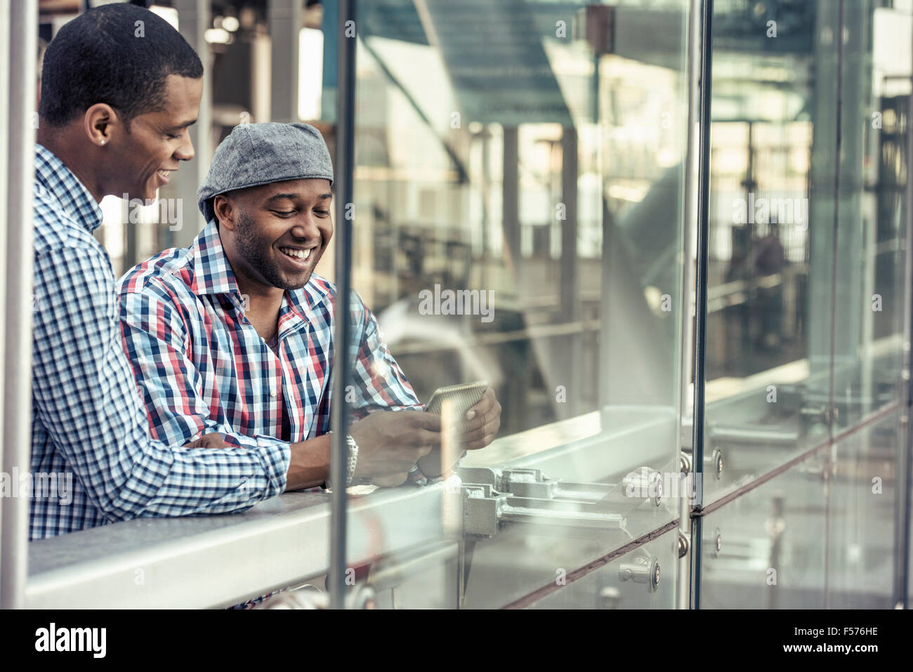 Two men standing side by side hi-res stock photography and images - Alamy