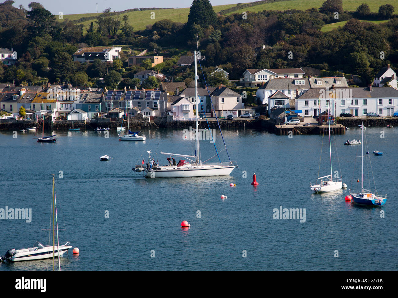 Yachts passing moorings on River Fal, Flushing, Cornwall, England, UK ...