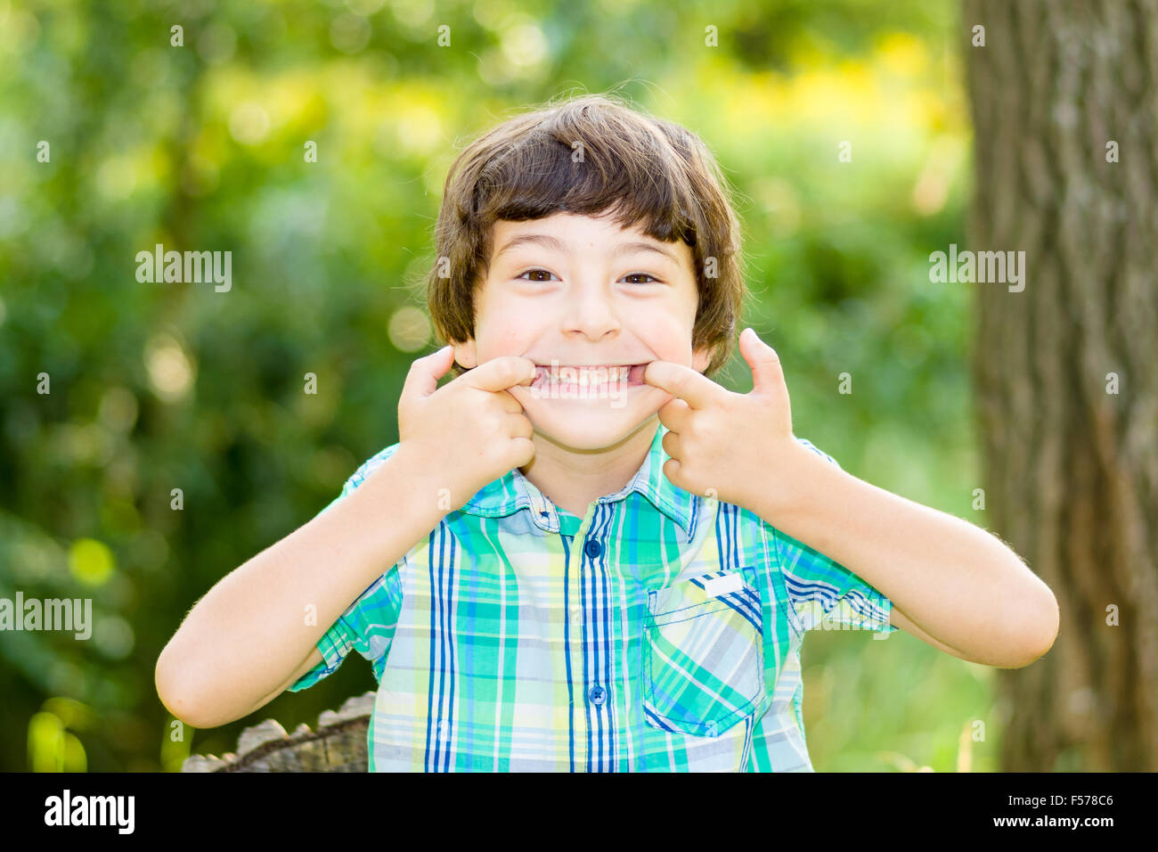 Young boy poses faces Stock Photo - Alamy