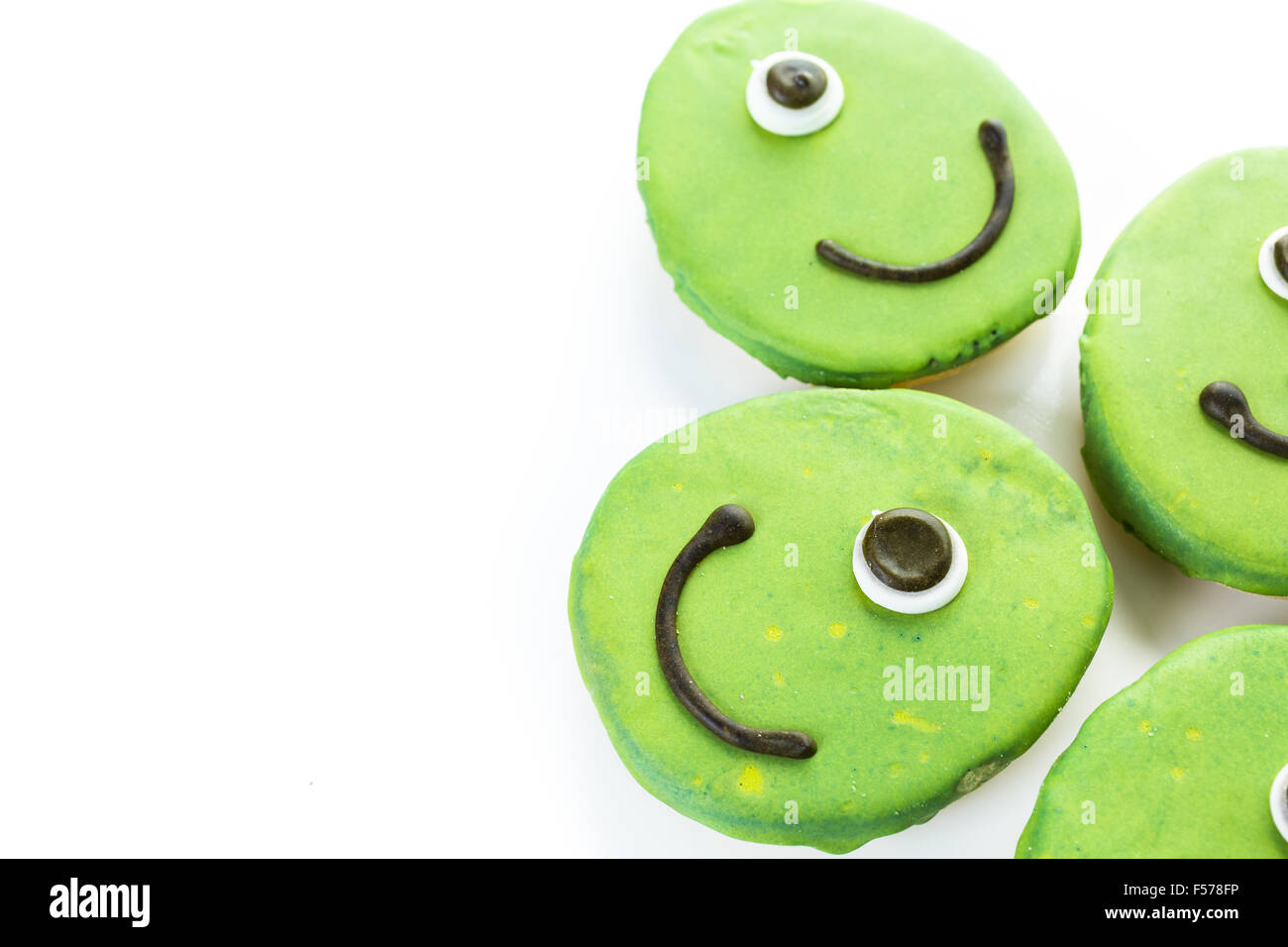 Alien cookies with green icing prepared as Halloween treats Stock Photo ...