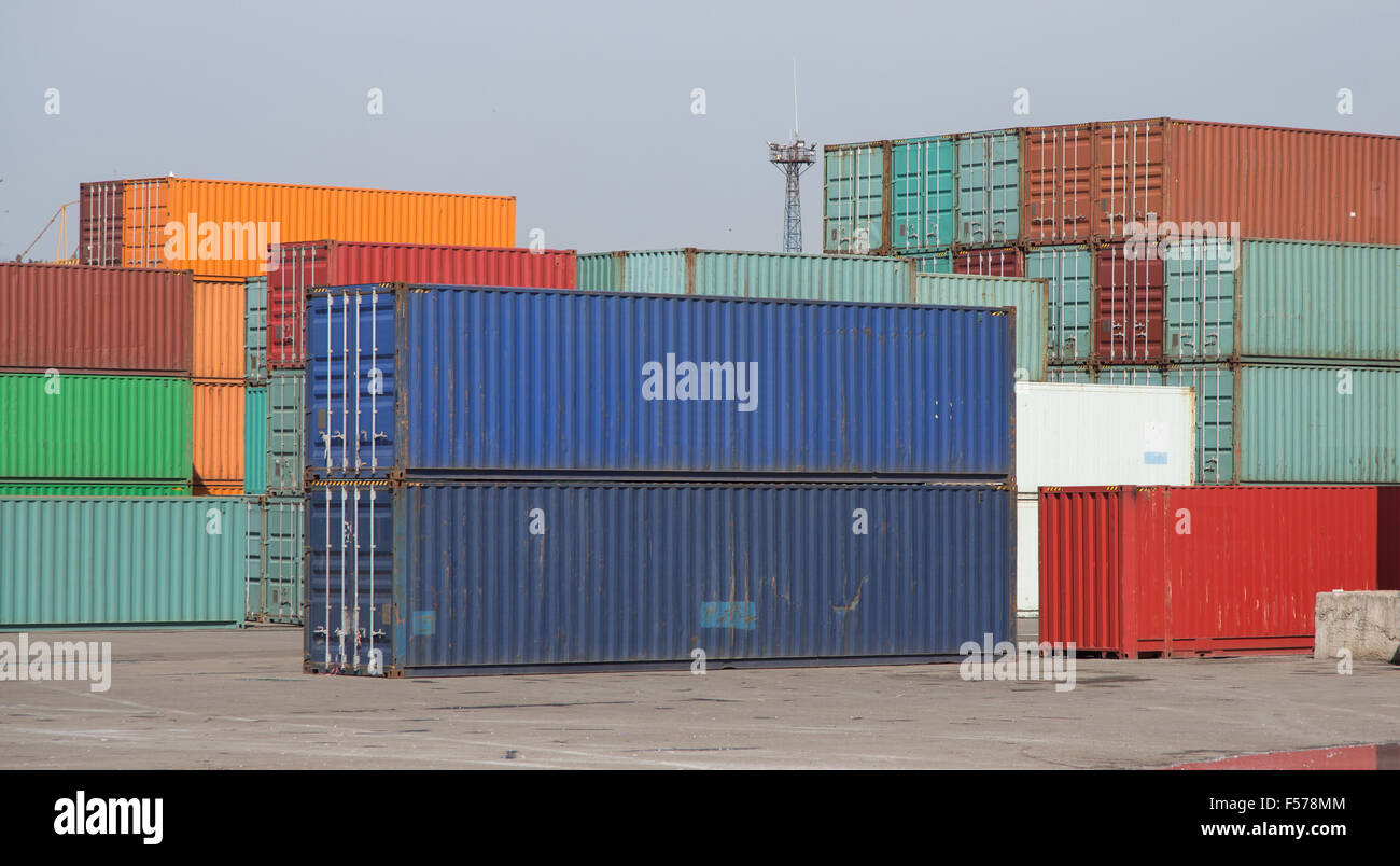 Containers waiting to transfer in a port Stock Photo - Alamy