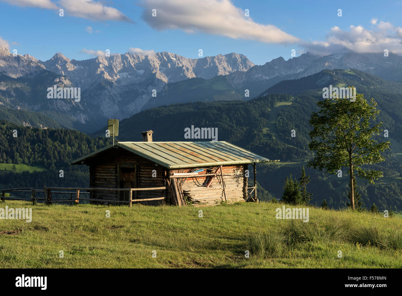 Old mountain barn with Wetterstein mountains in background, Garmisch ...