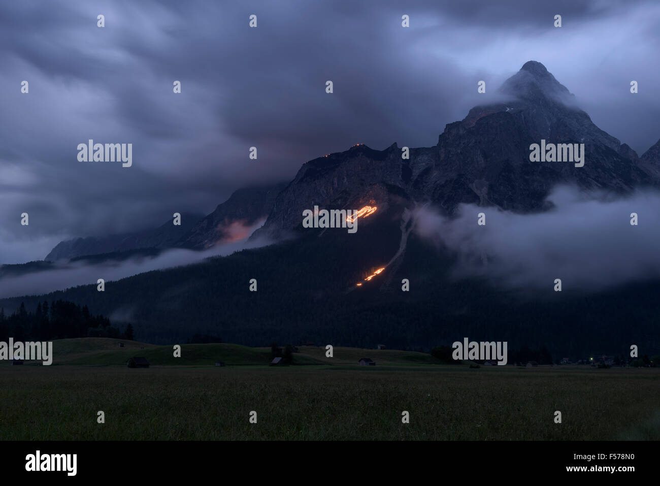 Midsummer fires on mountains in Zugspitze Arena, Lermoos, Tirol ...