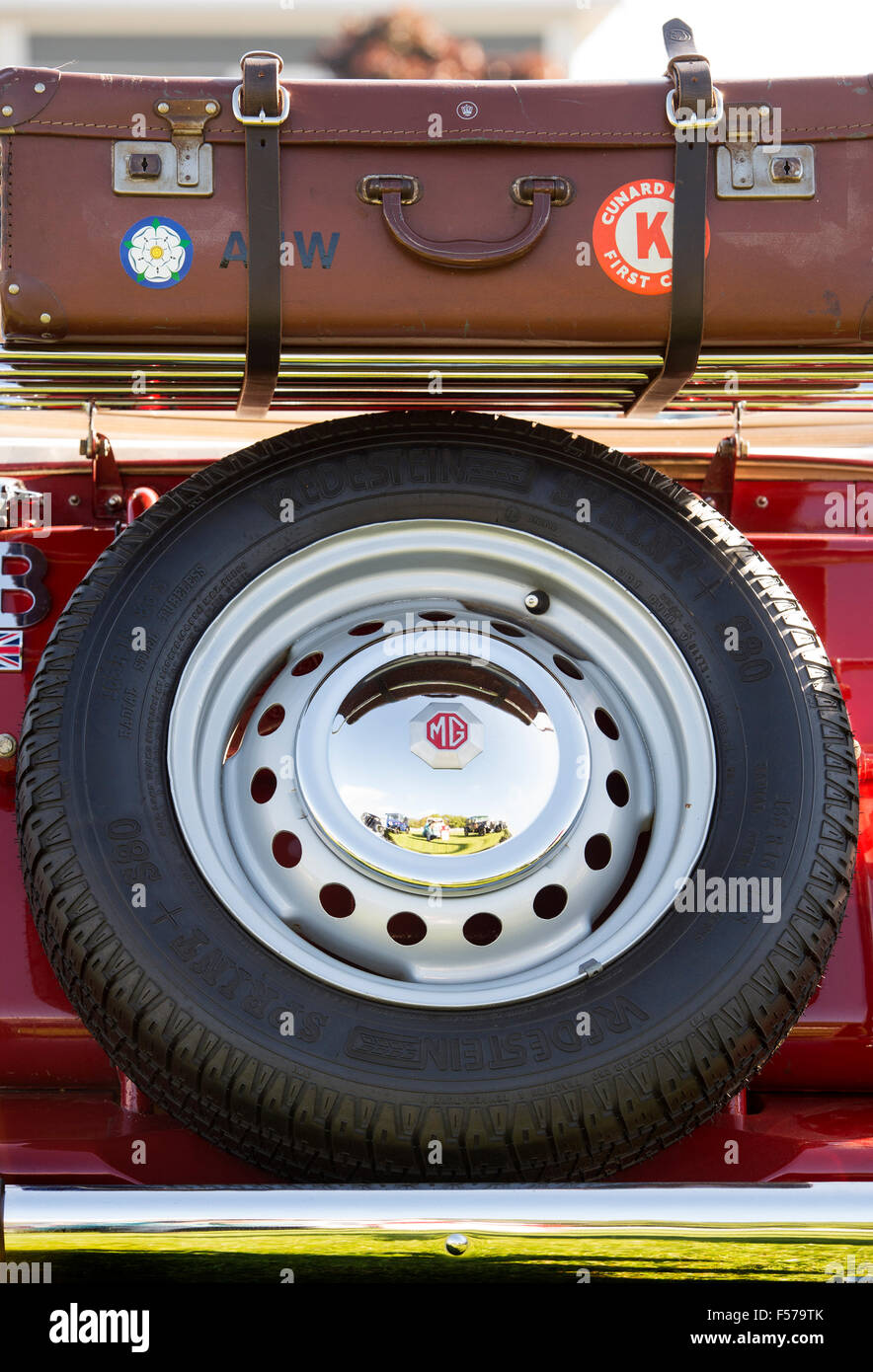 Vintage MG Spare wheel and suitcase on the rear of the car. Classic ...