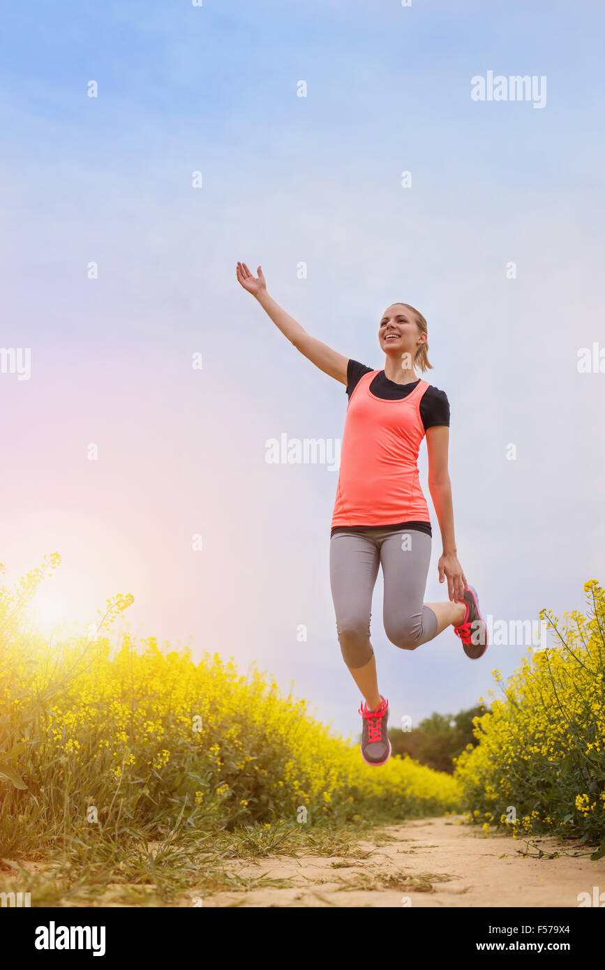 Young woman running Stock Photo - Alamy