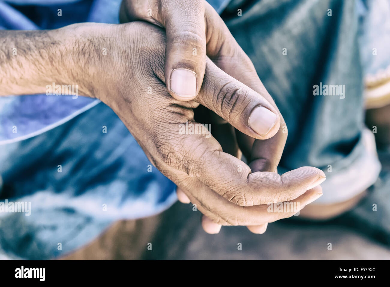 Resting hands of a worker Stock Photo - Alamy