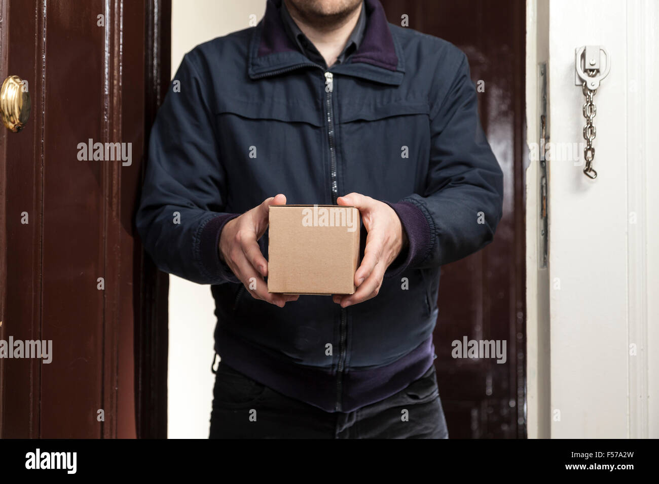 Postman delivers package hi-res stock photography and images - Alamy