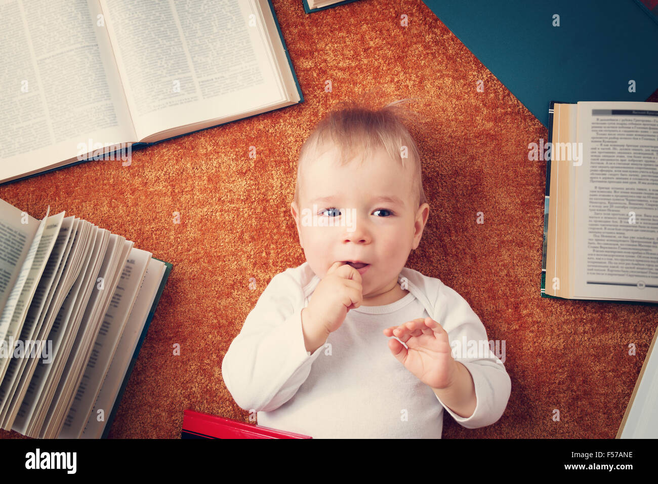 One year old baby with books Stock Photo - Alamy