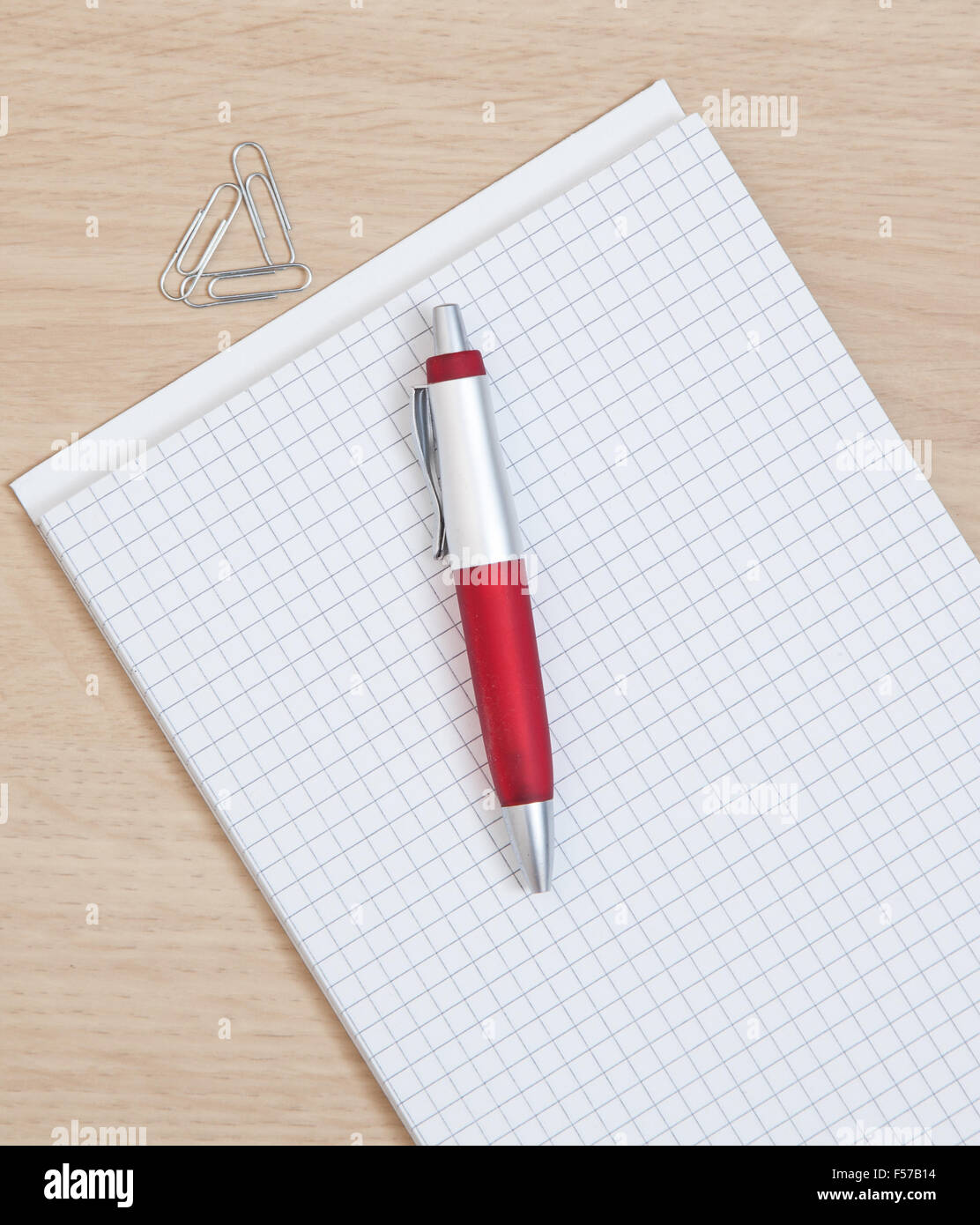 Pen and paper on desk Stock Photo - Alamy