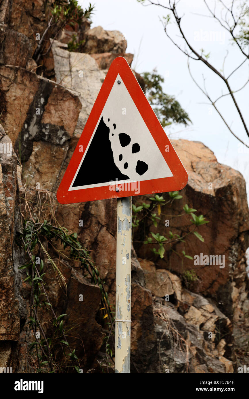 It's a photo of a road sign to aware of falling rocks Stock Photo - Alamy