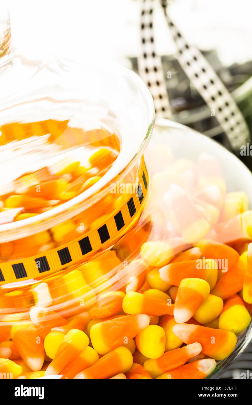 Candy corn in candy jar for Halloween treats Stock Photo - Alamy