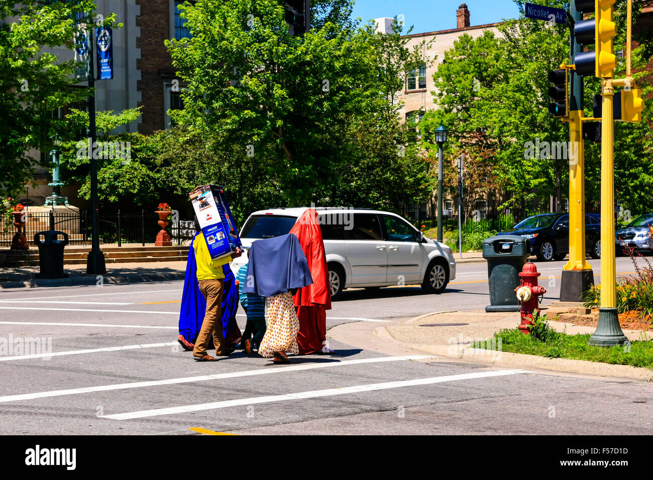 Muslim family using the cross-walk in Minneapolis MN Stock Photo - Alamy