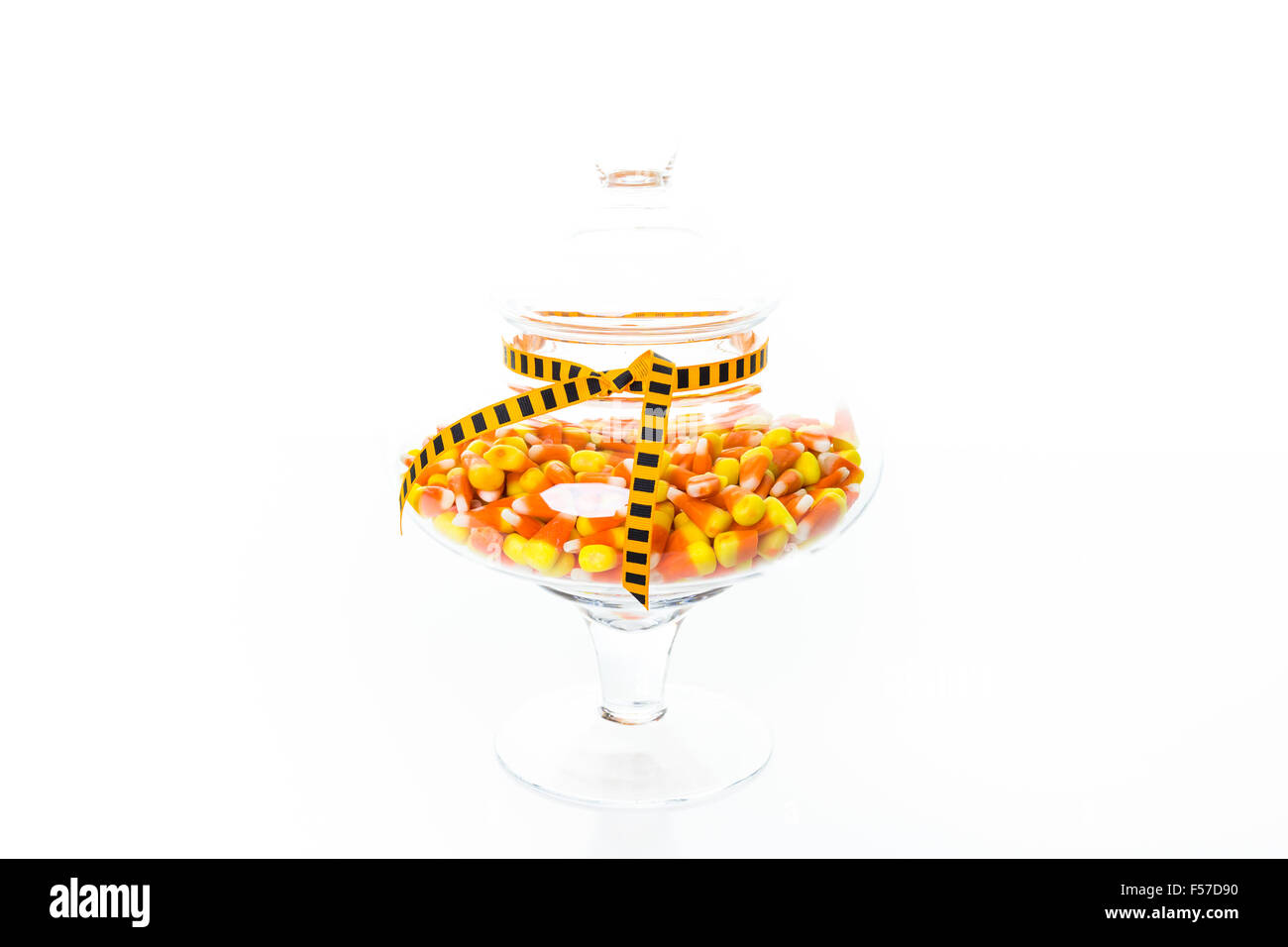 Candy corn in candy jar for Halloween treats Stock Photo - Alamy