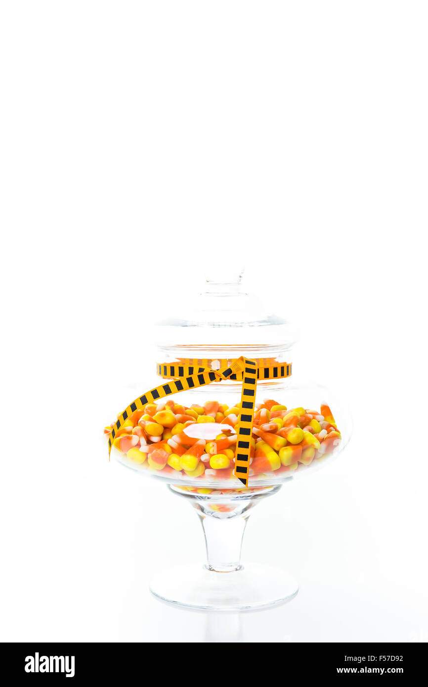 Candy corn in candy jar for Halloween treats Stock Photo - Alamy