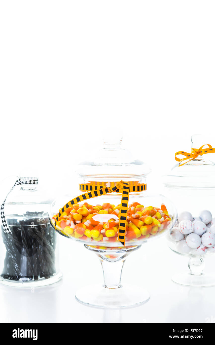 Candy corn in candy jar for Halloween treats Stock Photo - Alamy