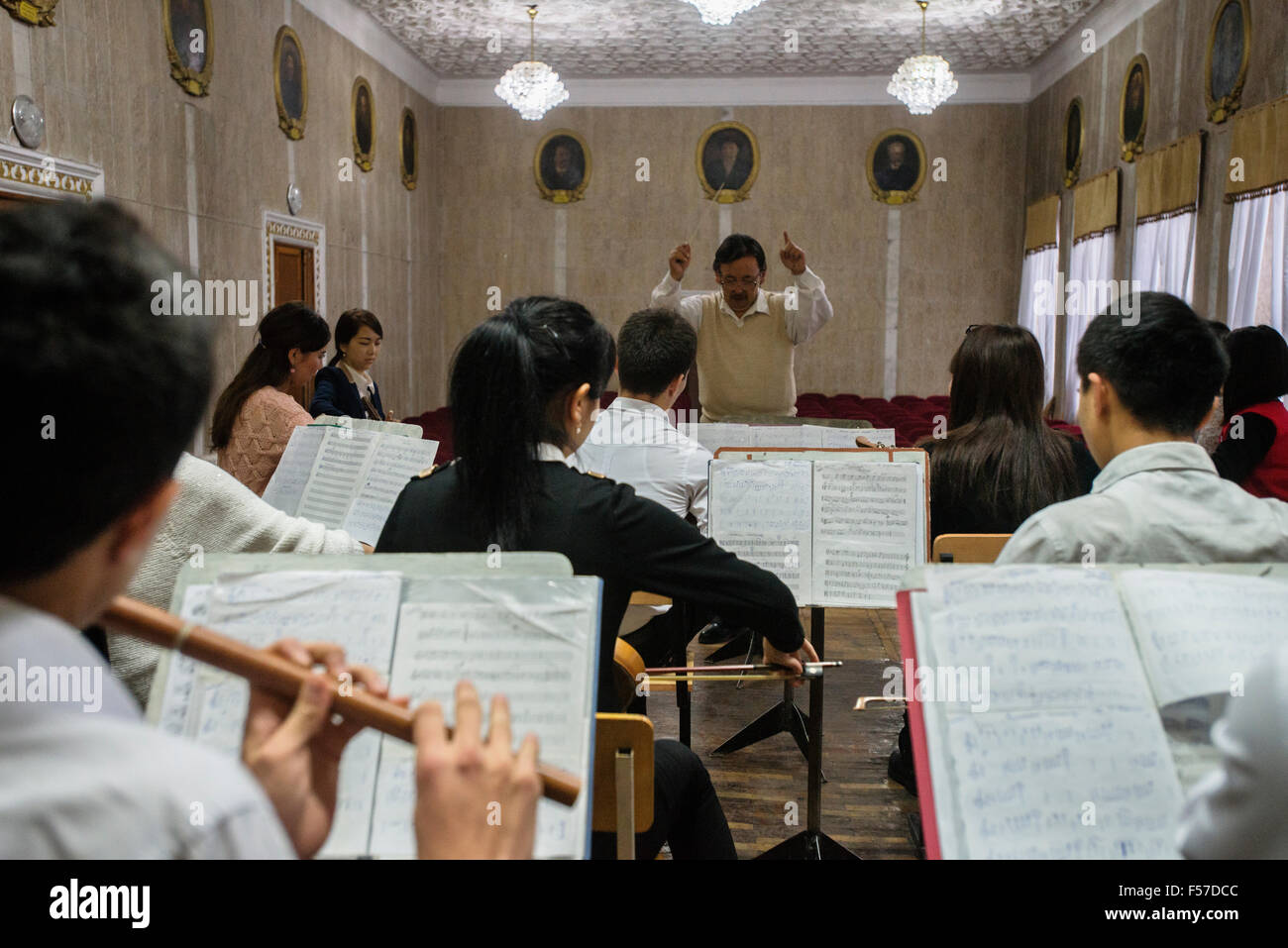 Kyrgyz authentic musical instruments orchestra play with conductor ...