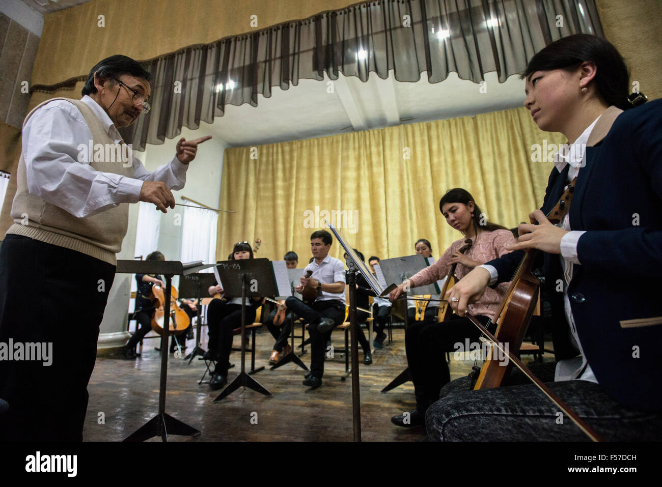 Kyrgyz authentic musical instruments orchestra play with conductor ...