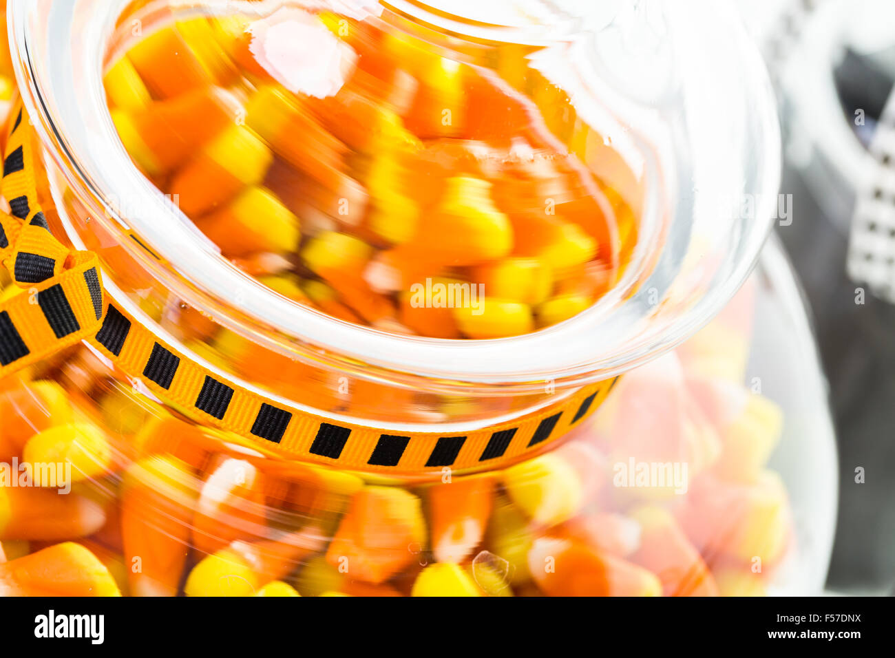 Candy corn in candy jar for Halloween treats Stock Photo - Alamy