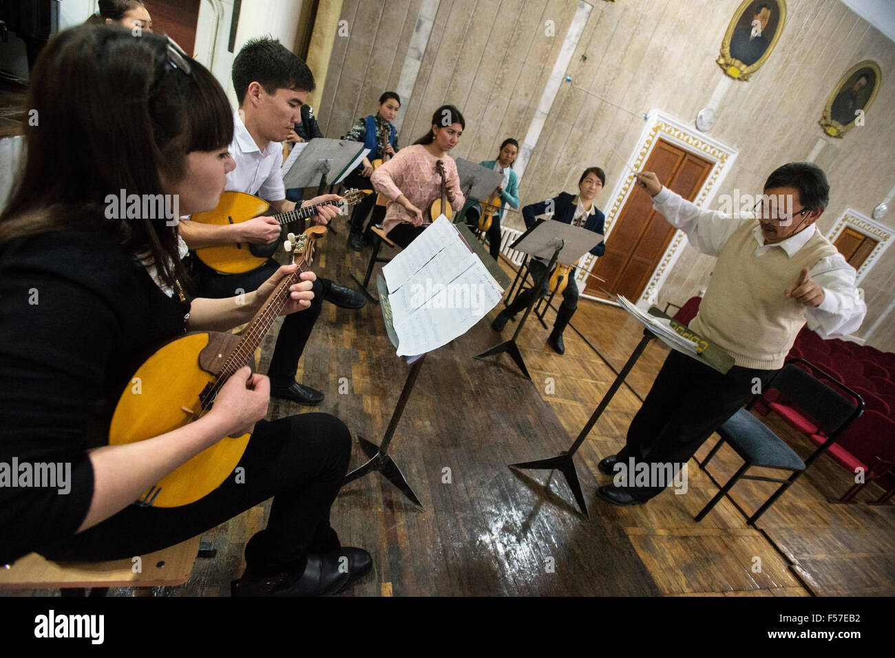 Kyrgyz authentic musical instruments orchestra play with conductor ...