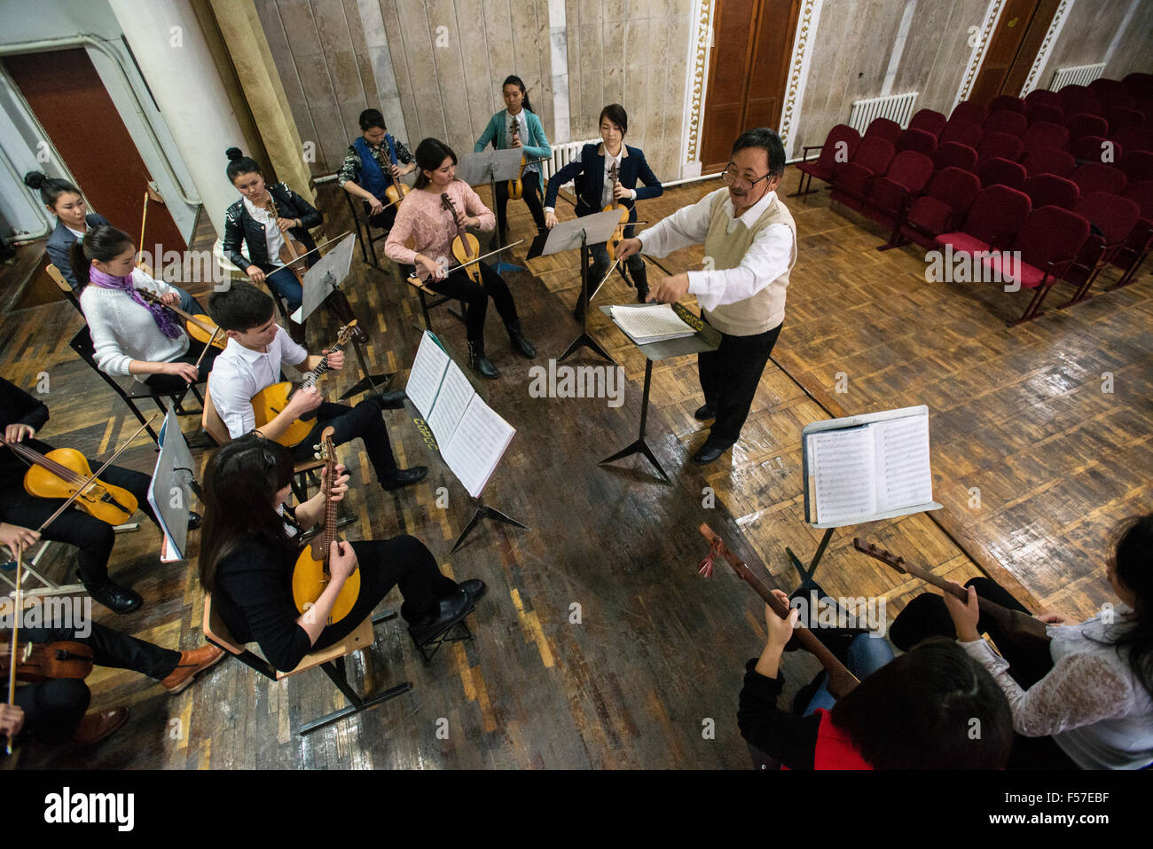 Kyrgyz authentic musical instruments orchestra play with conductor ...