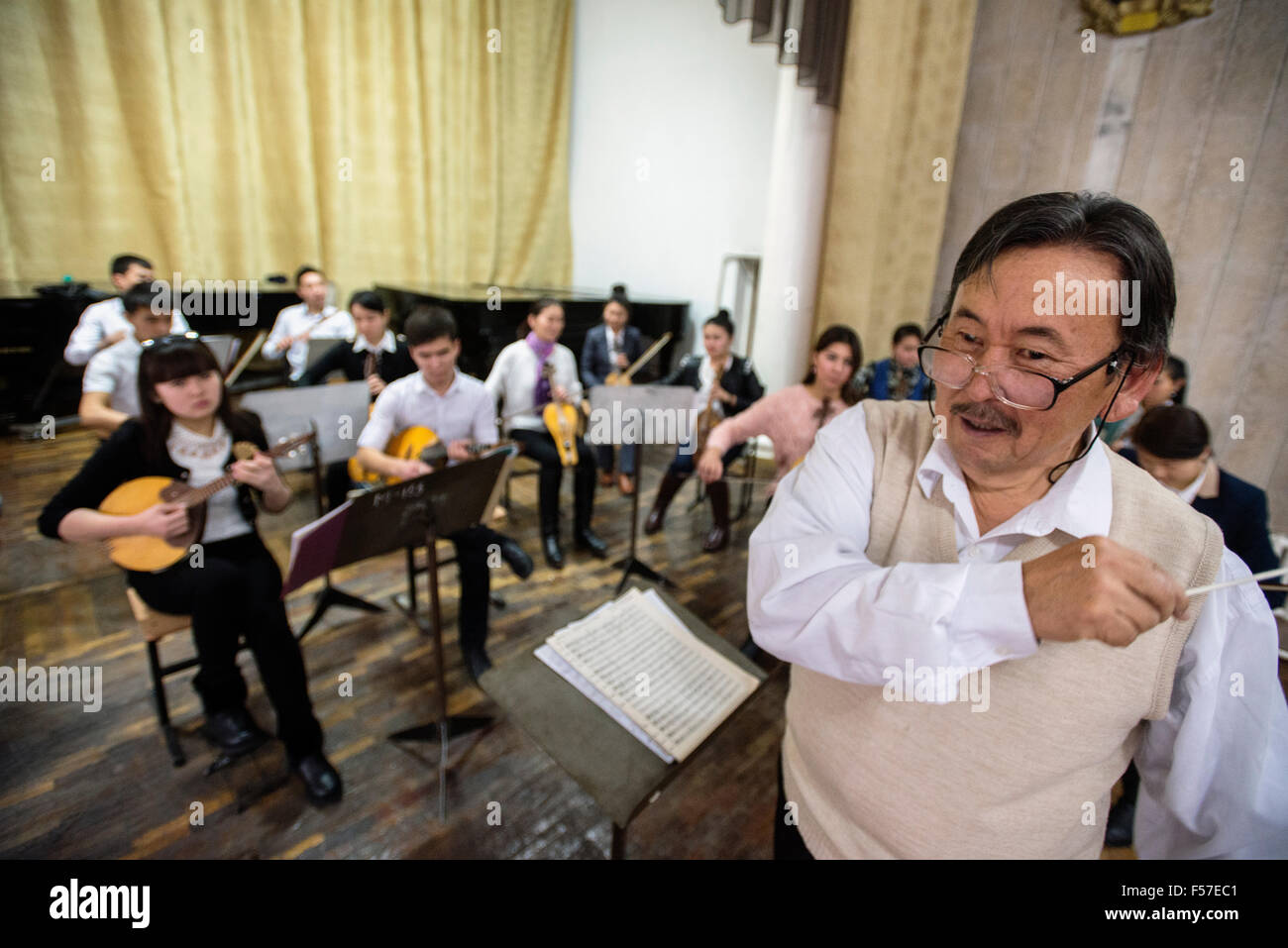 Kyrgyz authentic musical instruments orchestra play with conductor ...
