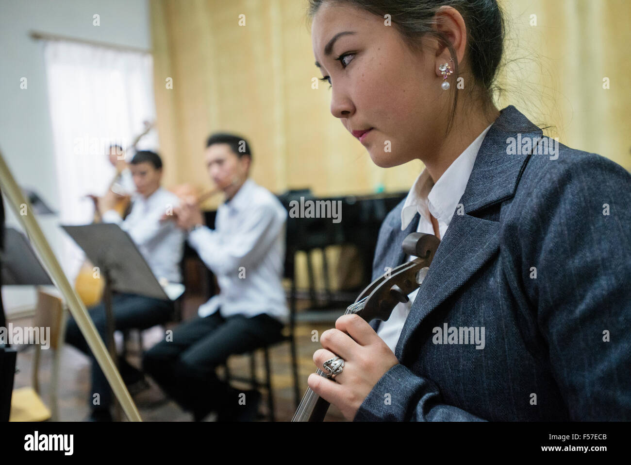 Kyrgyz authentic musical instruments orchestra play with conductor ...
