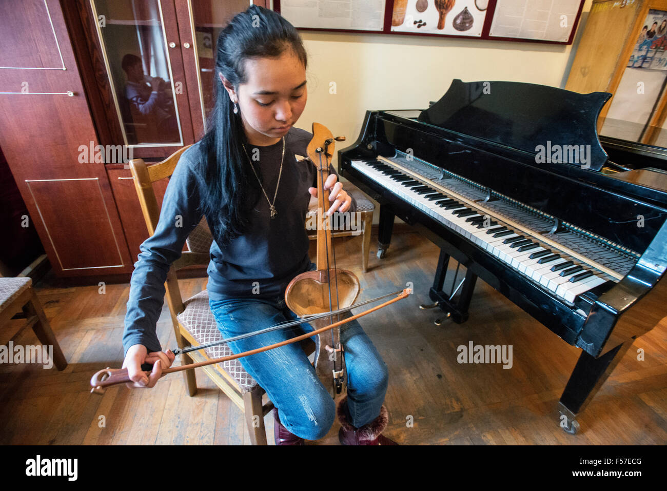 Student plays Kyl Kajak, traditional Kyrgyz bow instrument, during ...