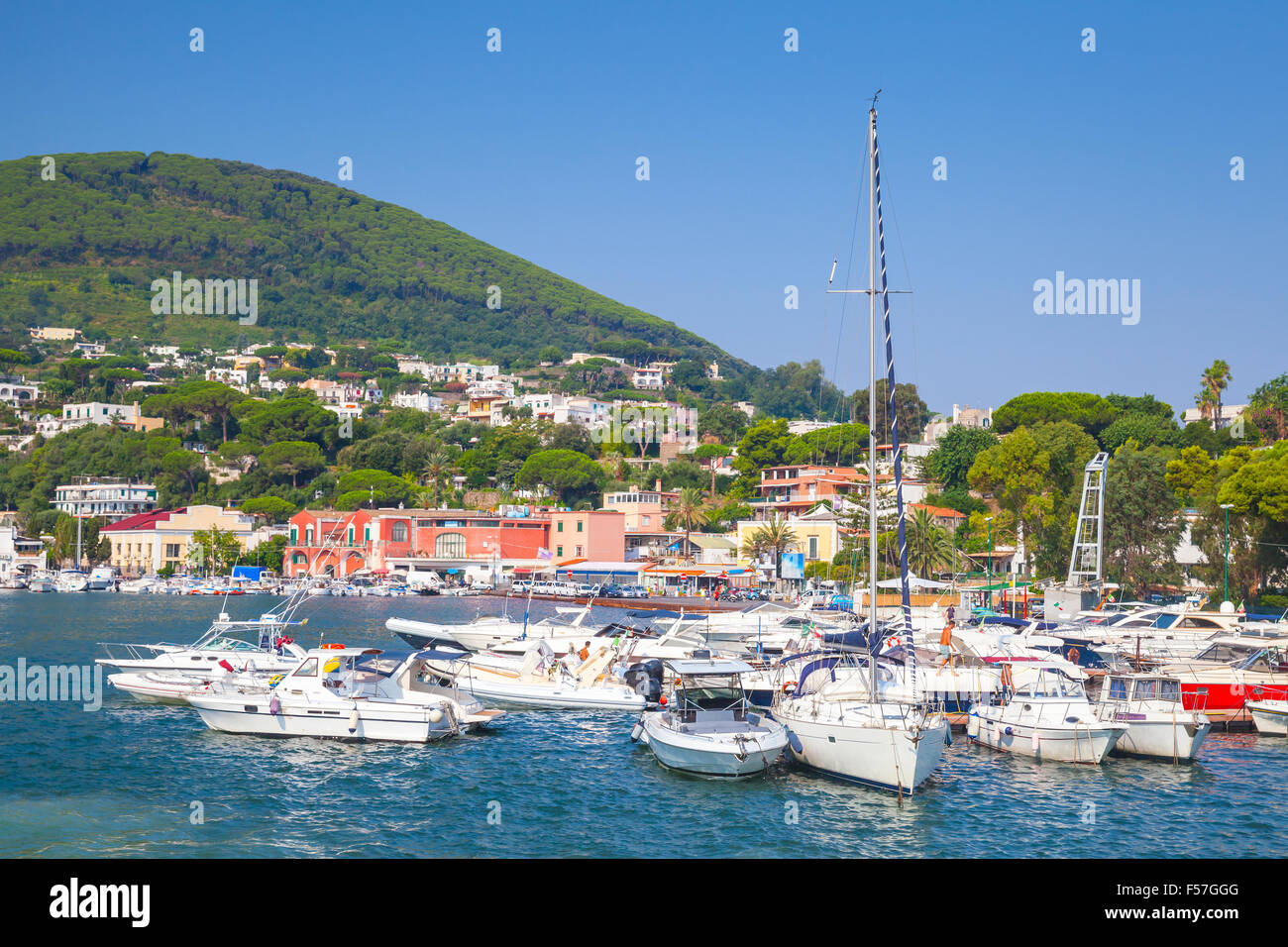 Yachts and pleasure motor boats moored in port of Ischia island ...