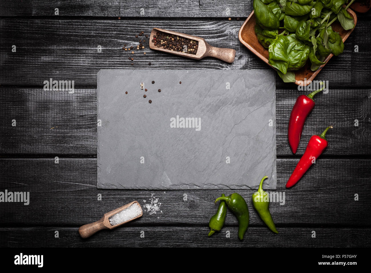 Stone board with different spices Stock Photo - Alamy
