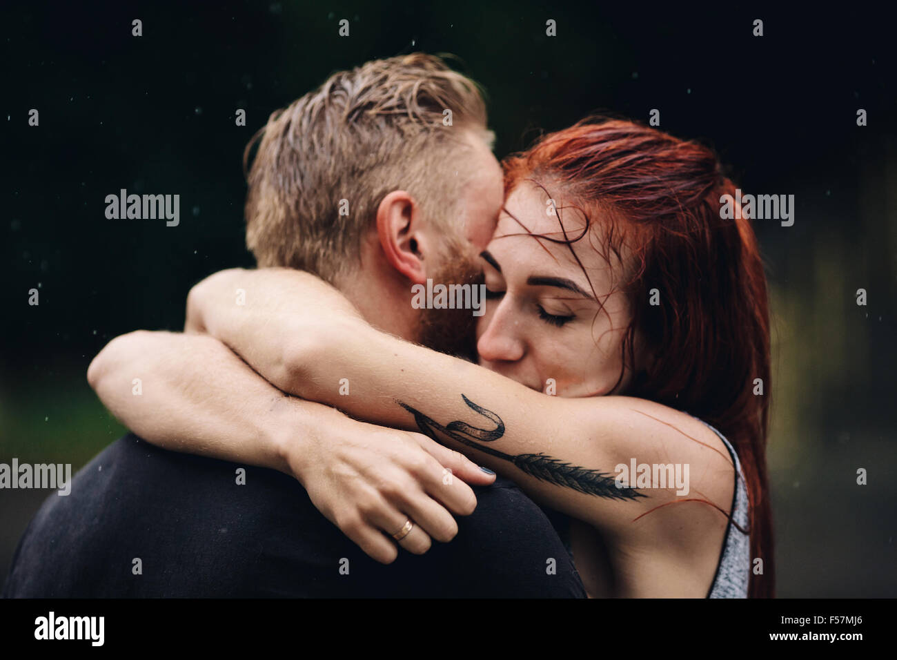 beautiful couple hugging in the rain Stock Photo - Alamy