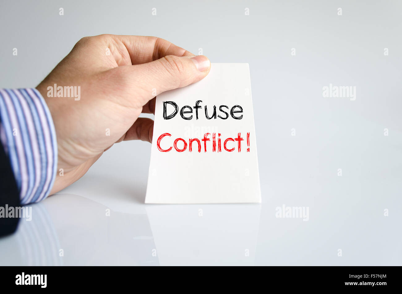 Defuse conflict text concept isolated over white background Stock Photo ...