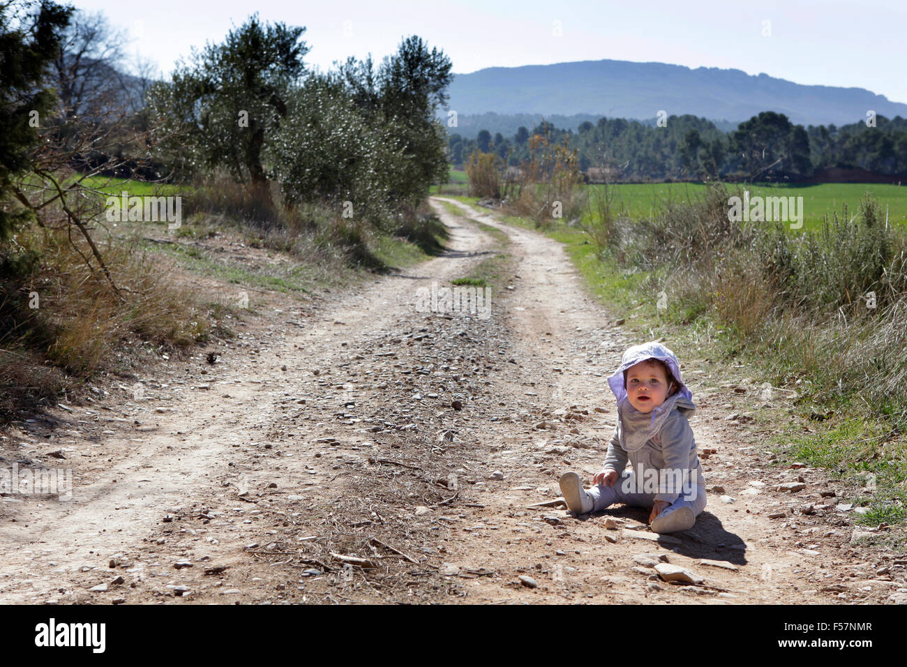 Lonely child on a path Stock Photo - Alamy