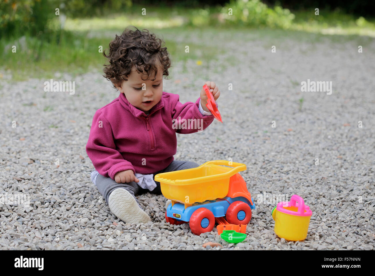 Little child playing alone Stock Photo - Alamy