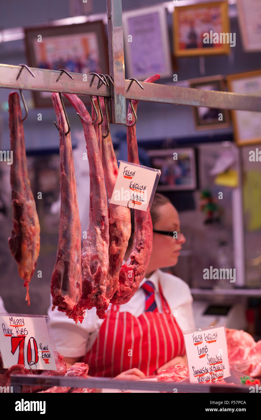 UK, Leeds, Ox tails hanging up in a butchers stall in Leeds Market ...