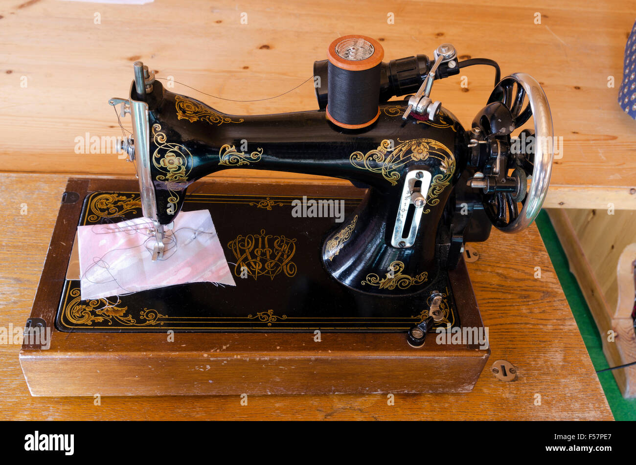 Old beautiful sewing machine still working,standing on a table Stock ...