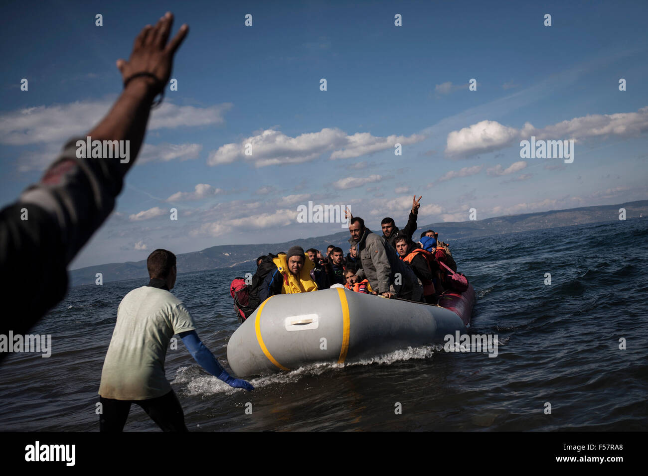 An overcrowded rubber dinghy boat full of refugees and migrants ...