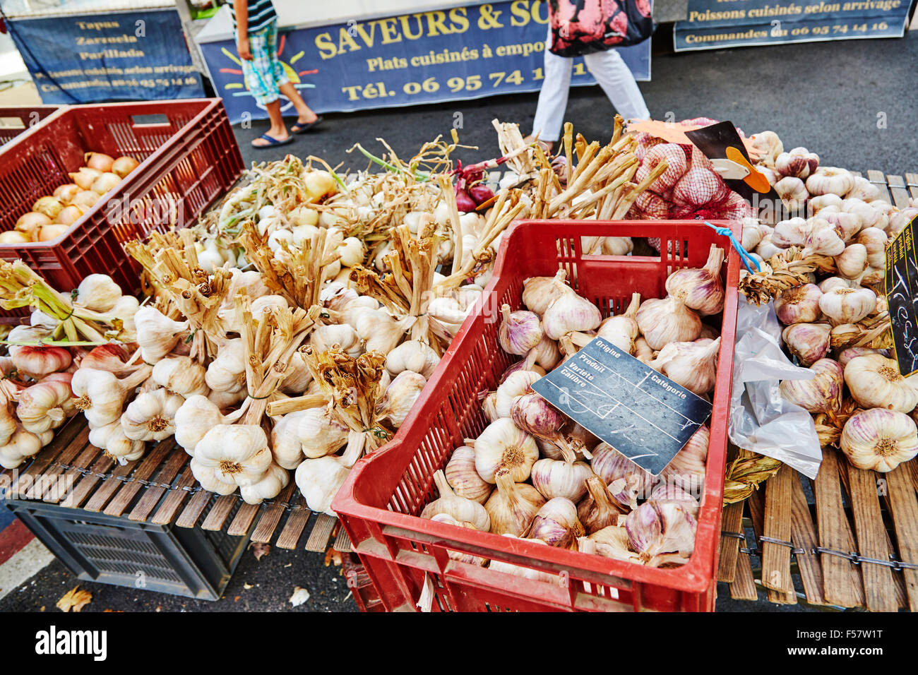 Street market stall in Objat, France selling garlic Stock Photo - Alamy