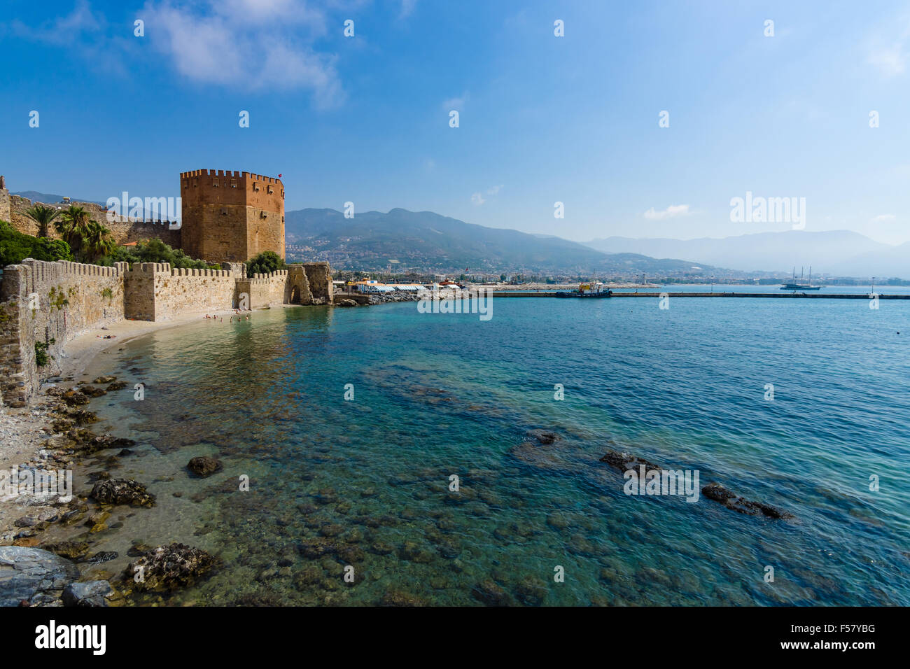 Red Tower (Kizil Kule) and the ruins of the fortress wall near the ...