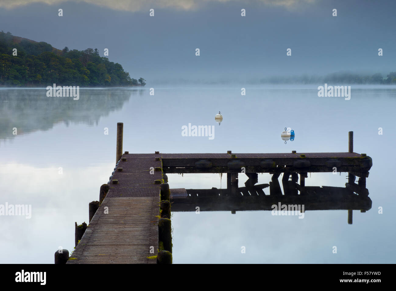 A Jetty stands on Ullswater Lake at Howtown at sunrise in the Lake ...