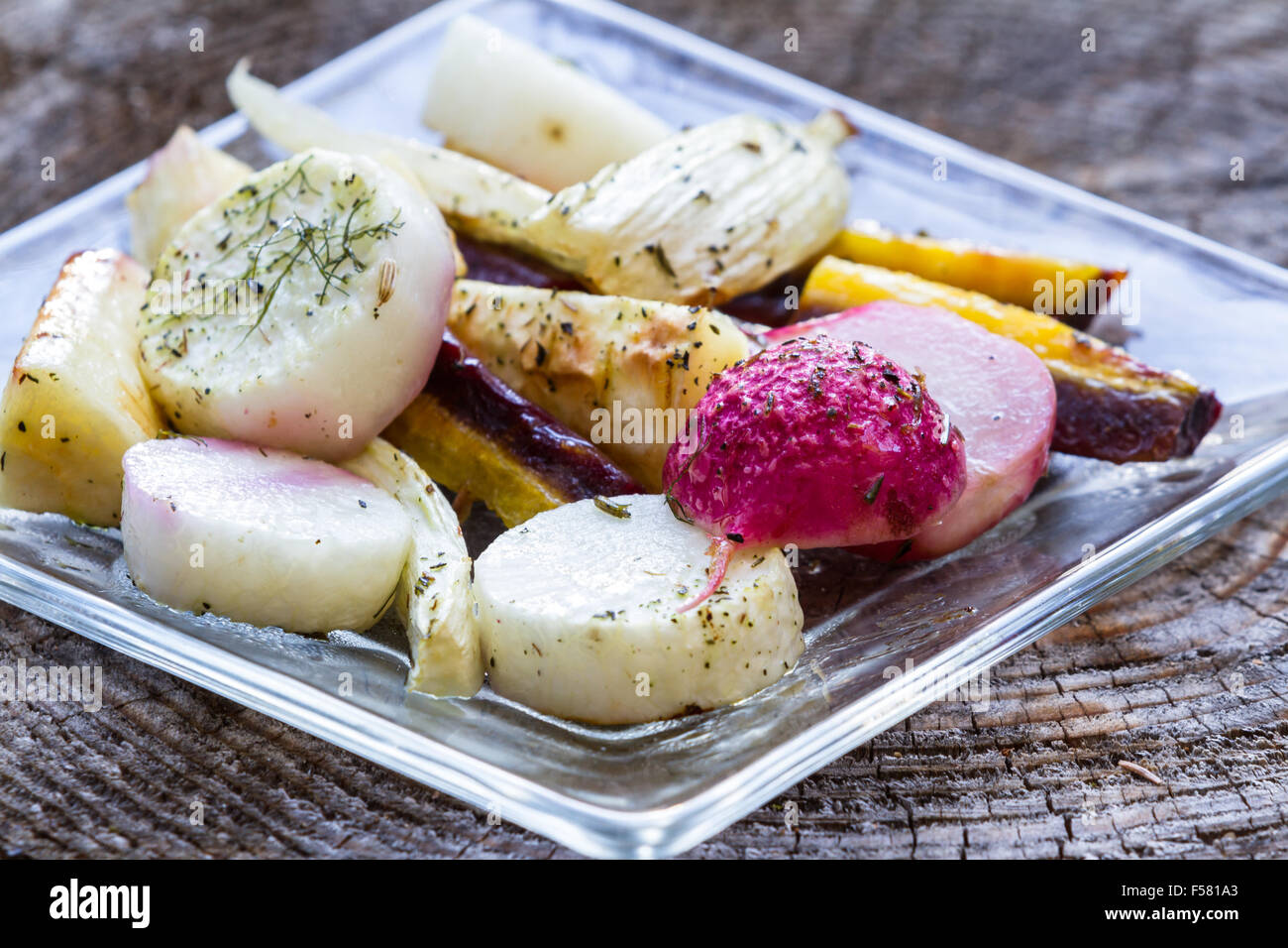 serving of fresh roasted garden vegetables with spices and drizzled ...