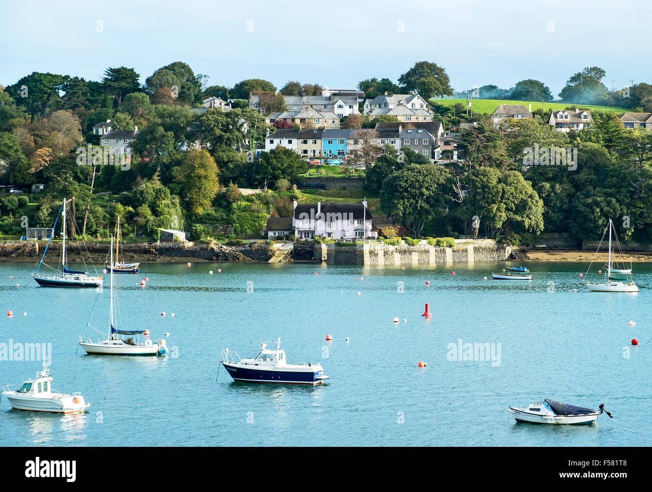 looking across Falmouth Bay to the village of Flushing in Cornwall, UK ...