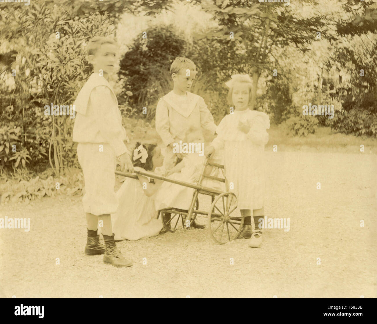 Children playing with a cart, Denmark Stock Photo - Alamy
