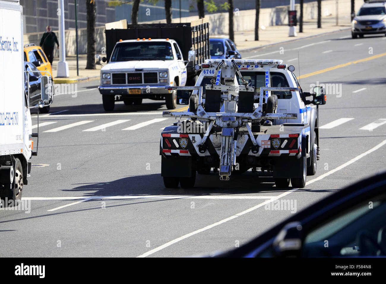 A NYPD New York Police Department tow truck patrol the street with No ...